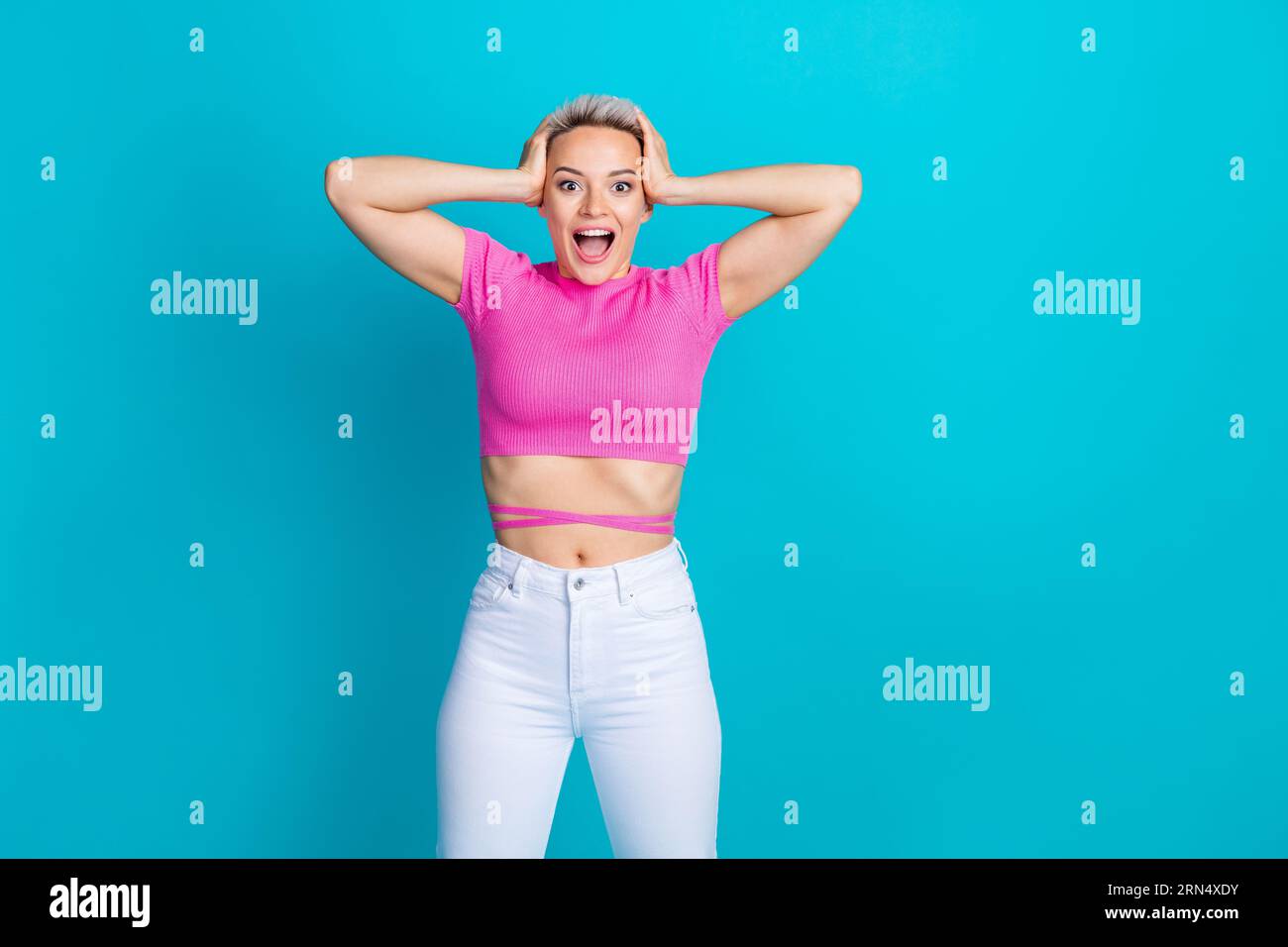 Photo portrait of pretty young girl arms touch head shouting shock wear ...