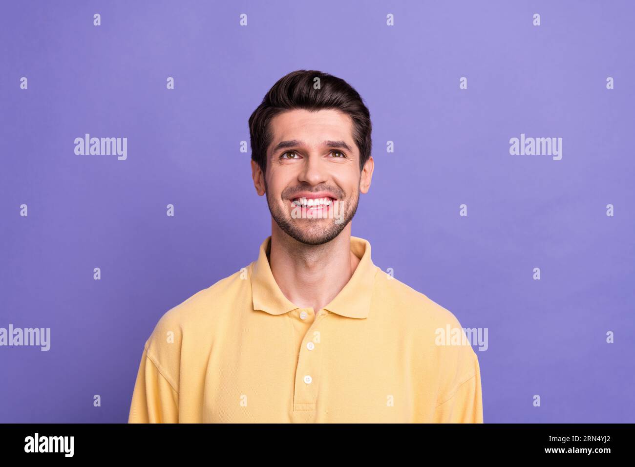 Photo of dreamy funky man dressed yellow shirt looking up empty space ...