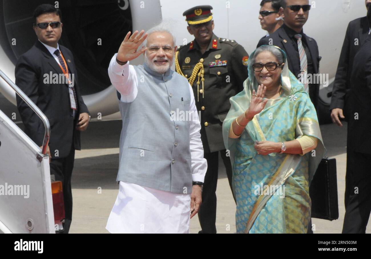 Indian Prime Minister Narendra Modi (L, front) gestures after arriving ...
