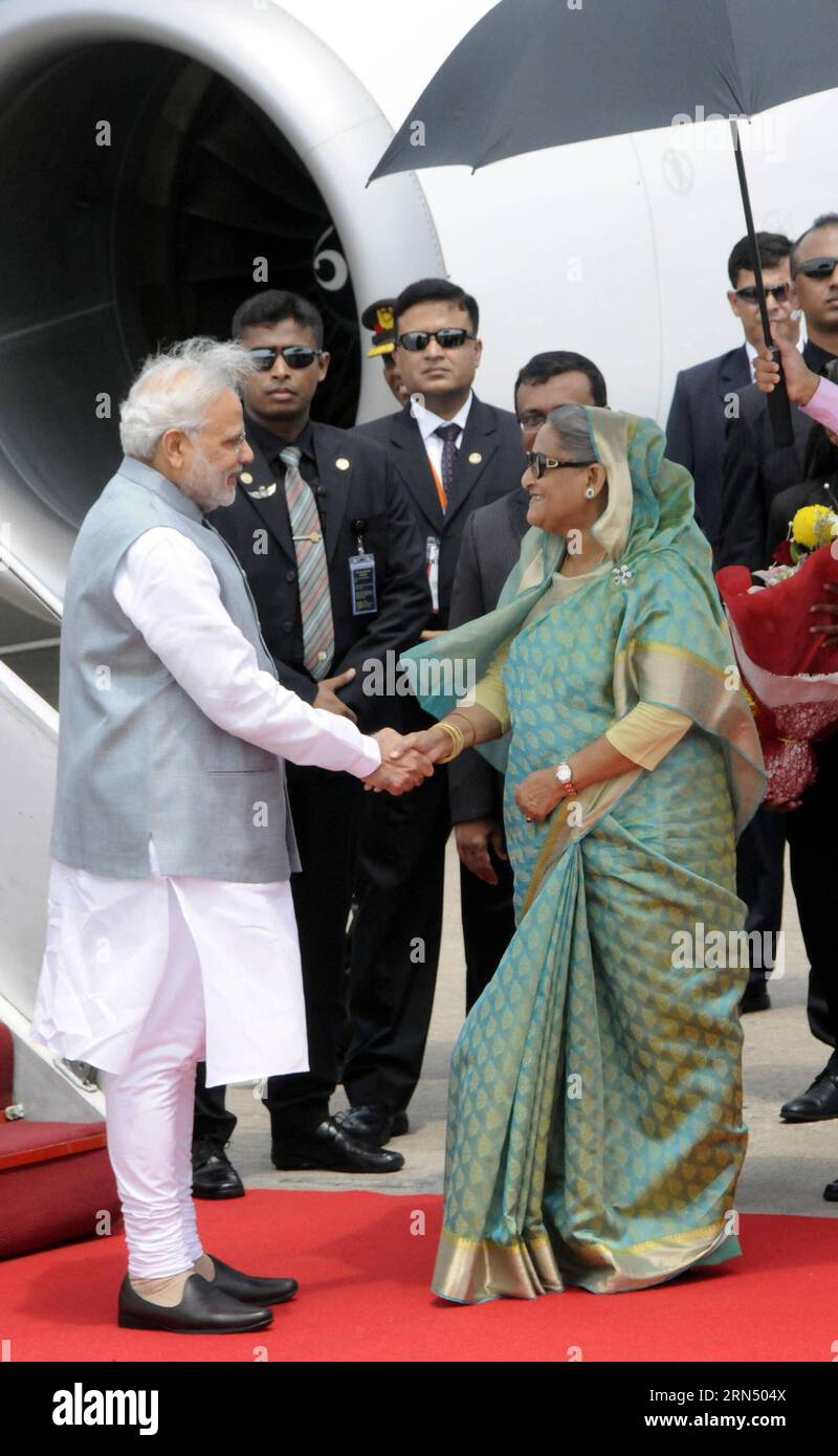 Bangladeshi Prime Minister Sheikh Hasina (R, front) shakes hands with ...