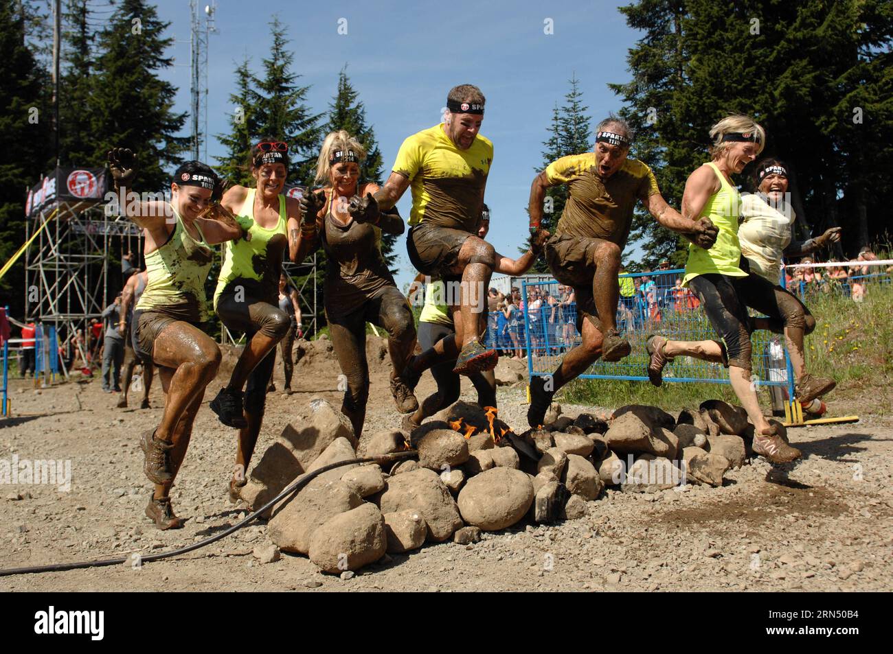 Competitors participate in the 2015 Spartan Race obstacle racing ...
