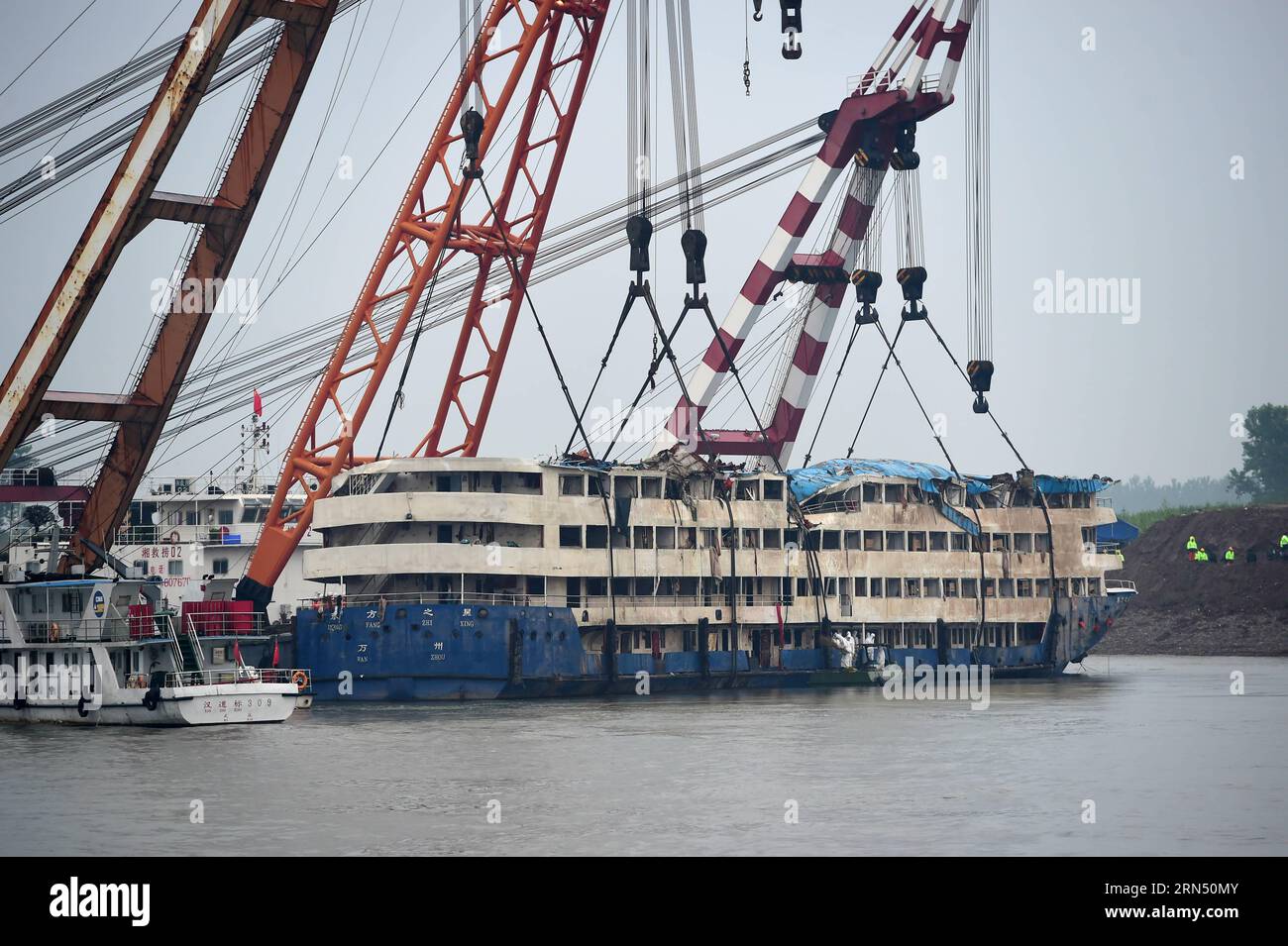 Rescuers work in the hull of the upright ship Eastern Star in an effort ...
