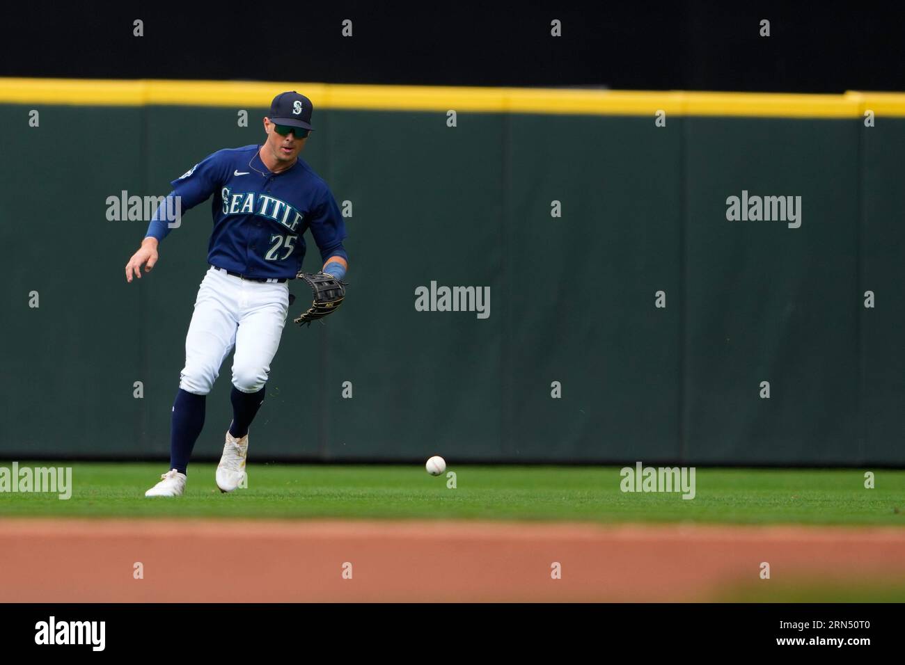Seattle Mariners center fielder Dylan Moore fields a ground ball in a ...