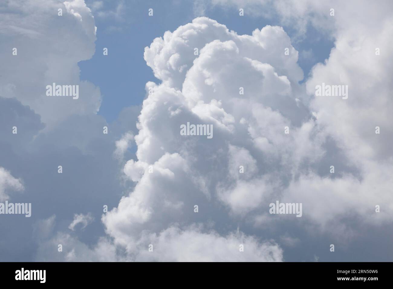 White spring clouds, blue sky, Germany Stock Photo - Alamy
