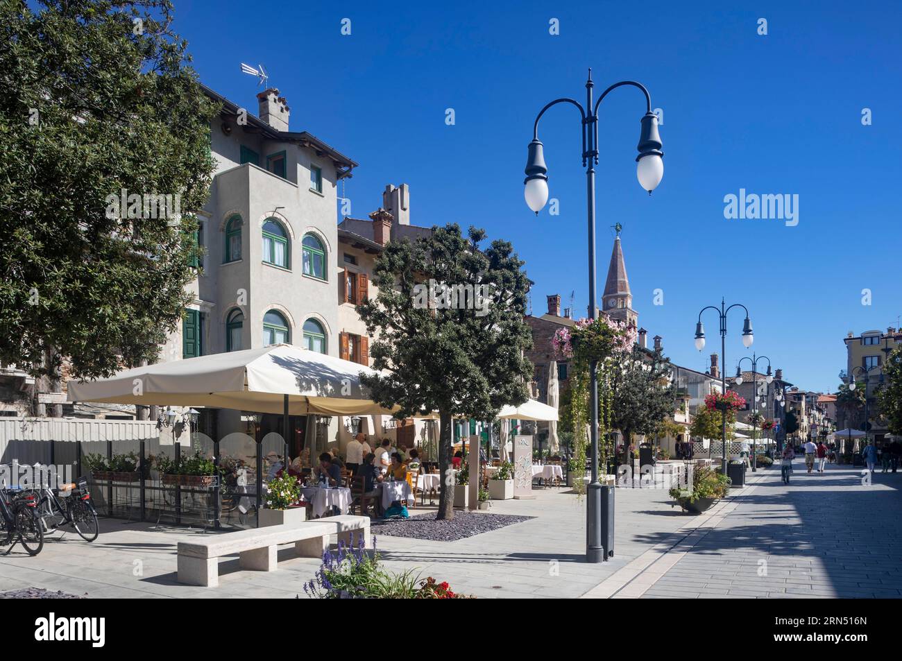 Pedestrian zone with restaurants in the old town of Grado, Friuli ...