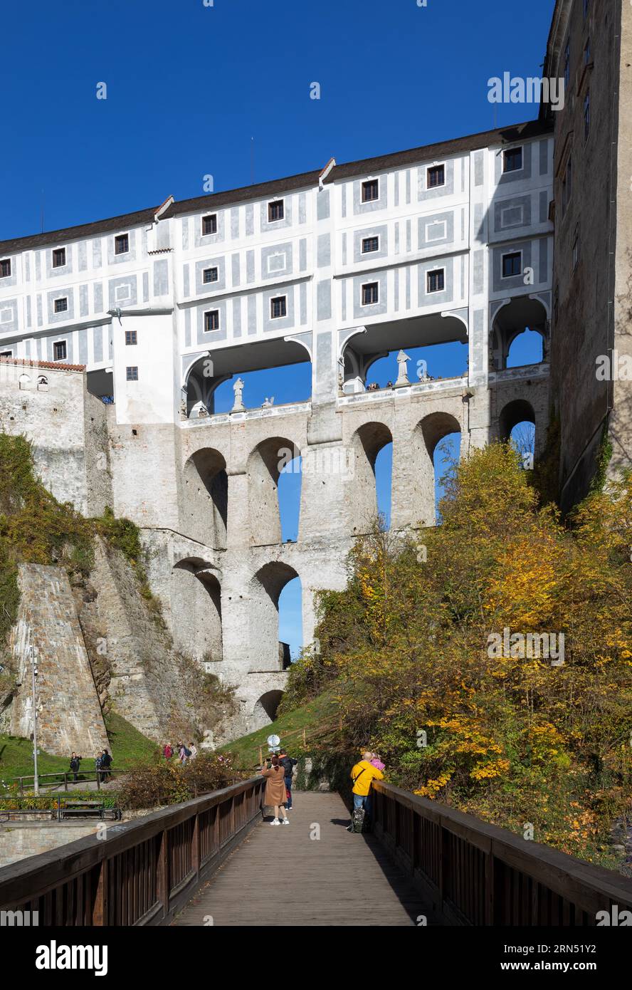 Pedestrian bridge over the Vltava with Mantle Bridge and Krumlov Castle ...