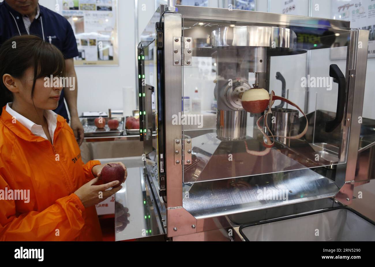 Photo taken on June 9, 2015 shows an auto peeling machine demonstrated ...