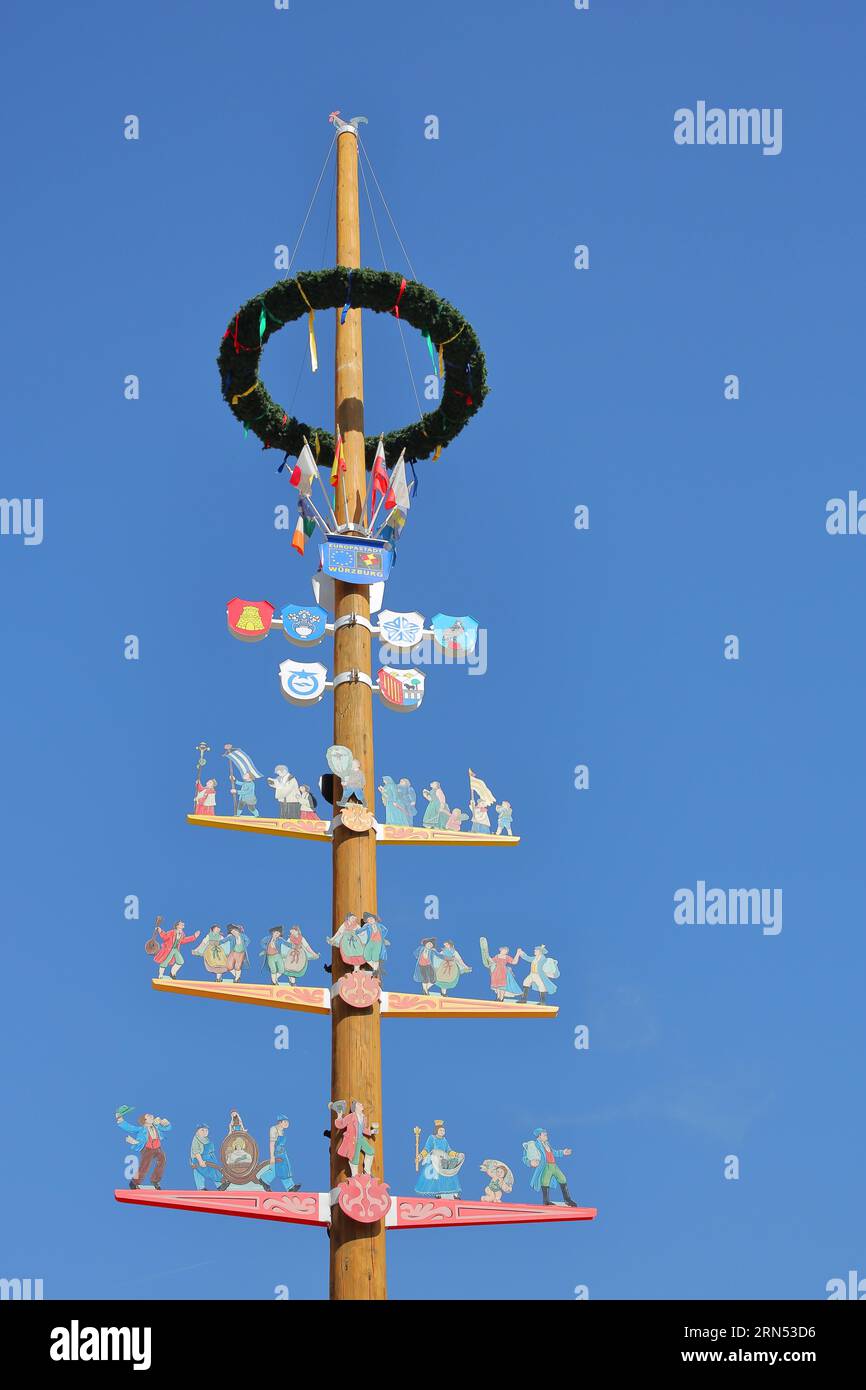 Maypole with wreath, coat of arms, guild signs and figures on the ...
