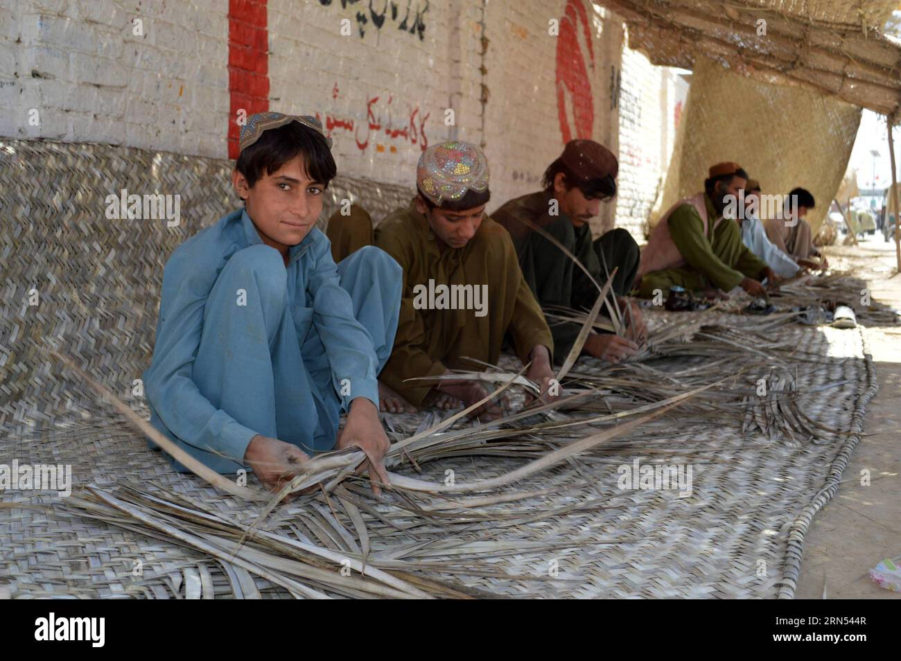 (150612) -- QUETTA, June 12, 2015 -- Pakistani boys work at a craft ...