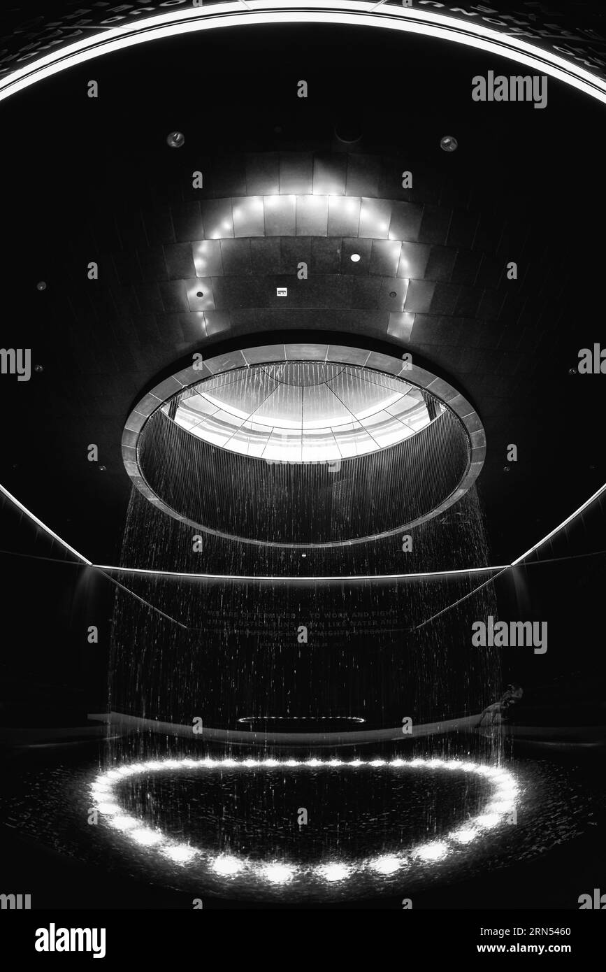 Indoor waterfall, City. Black and white photograph showing a circular ...