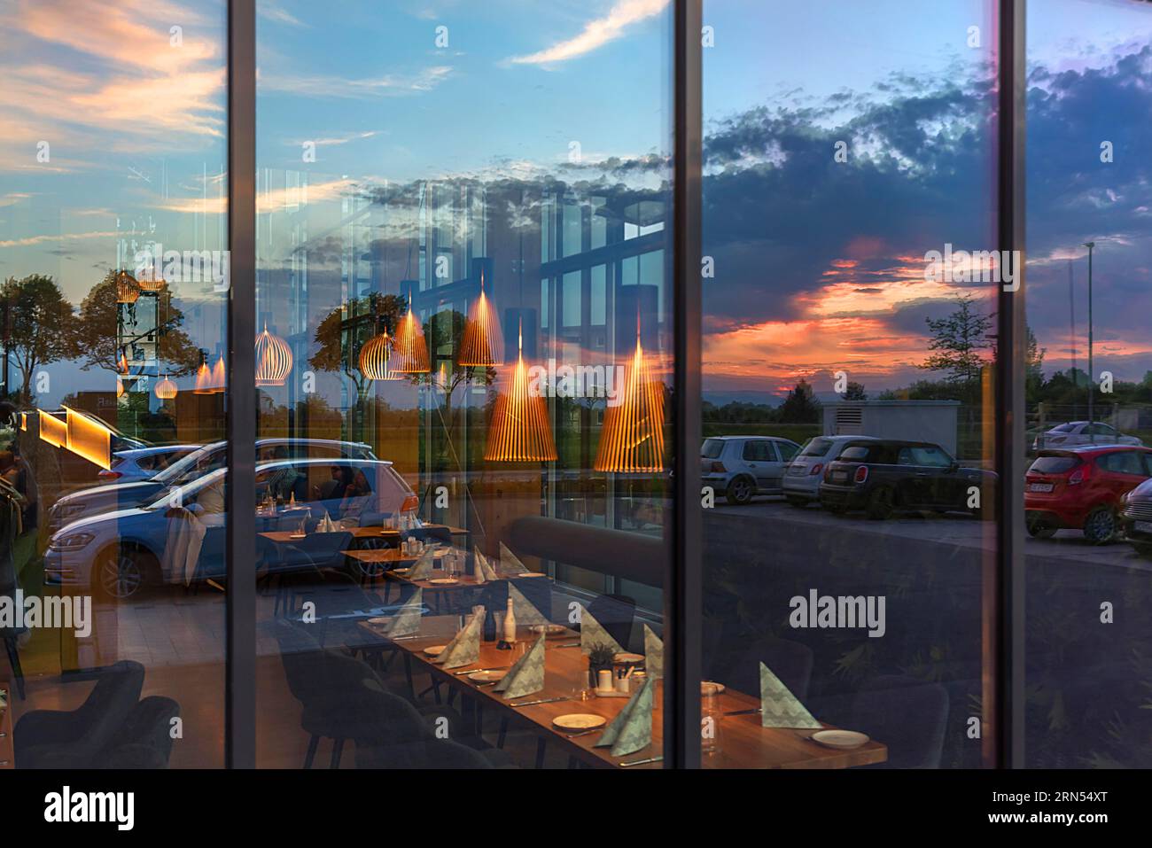 Evening atmosphere, reflection on the glass facade of the restaurant ...
