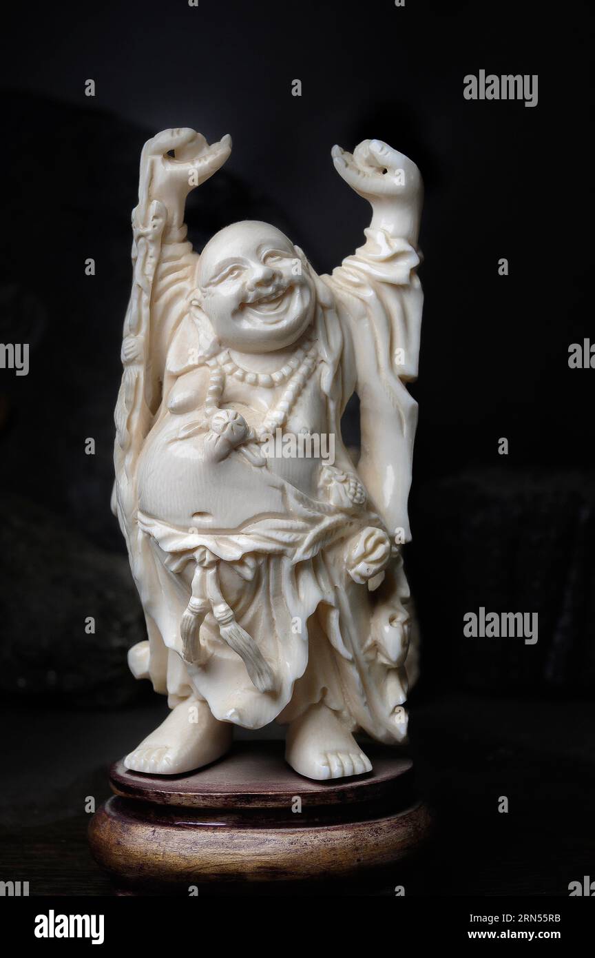 Cheerful, thick-legged Buddha figure made of ivory, souvenir from Hong ...