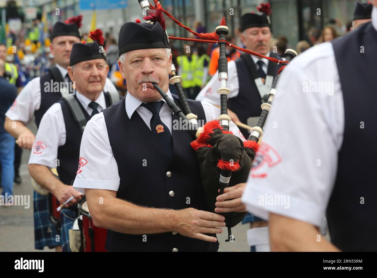 Bagpipers participating in the Fleadh Cheoil parade on the last day of ...