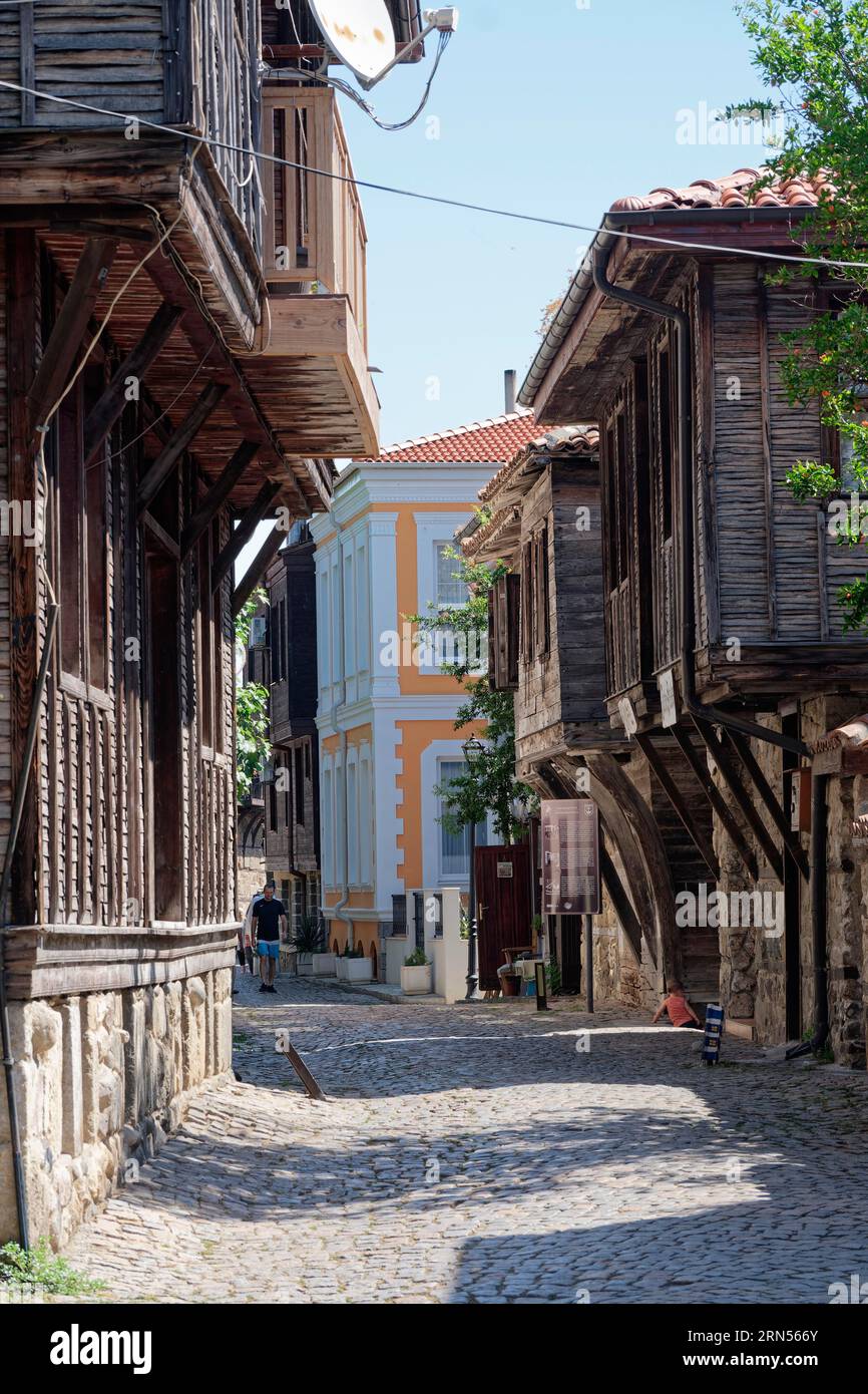 Half-timbered houses with typical roof overhang on the cobbled street ...