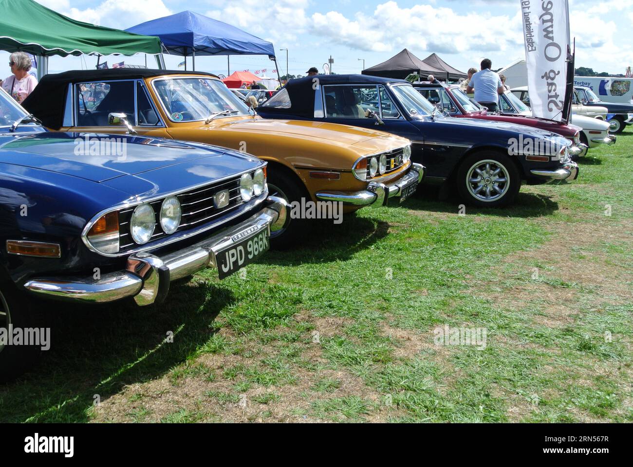 A line of Triumph classic cars parked up on display at the English ...