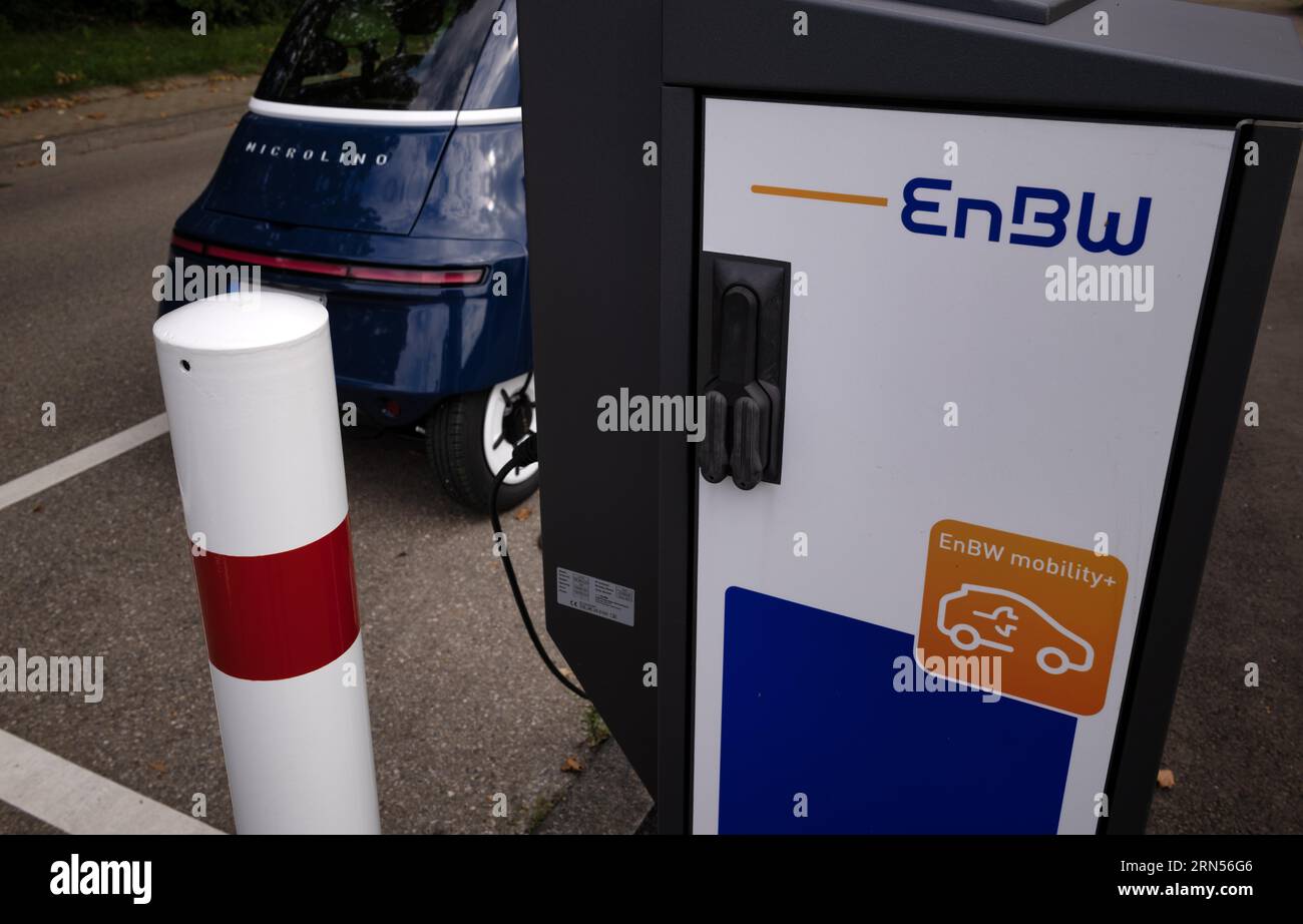 E-light vehicle, cabin scooter MICROLINO at charging station EnBW for electric cars, electric ...