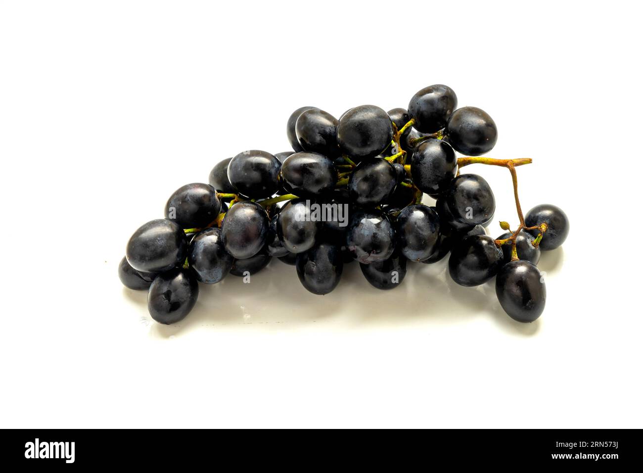 Black fresh grapes cluster in white background Stock Photo - Alamy