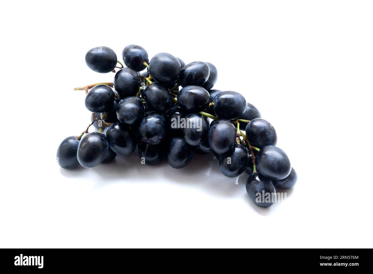 Black fresh grapes cluster in white background Stock Photo - Alamy