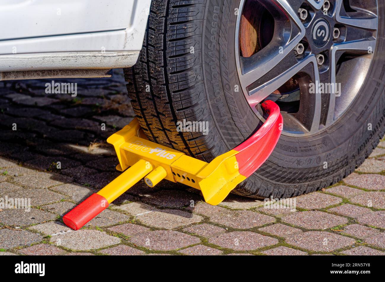 Berlin, Germany - February 22, 2021: Wheel of a car secured against ...