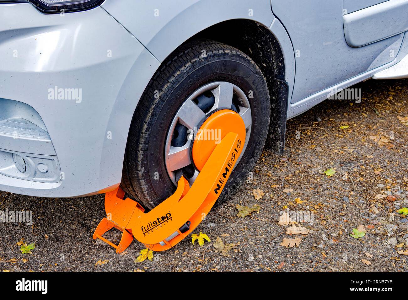 Berlin, Germany - October 6, 2021: Wheel of a car secured against theft ...