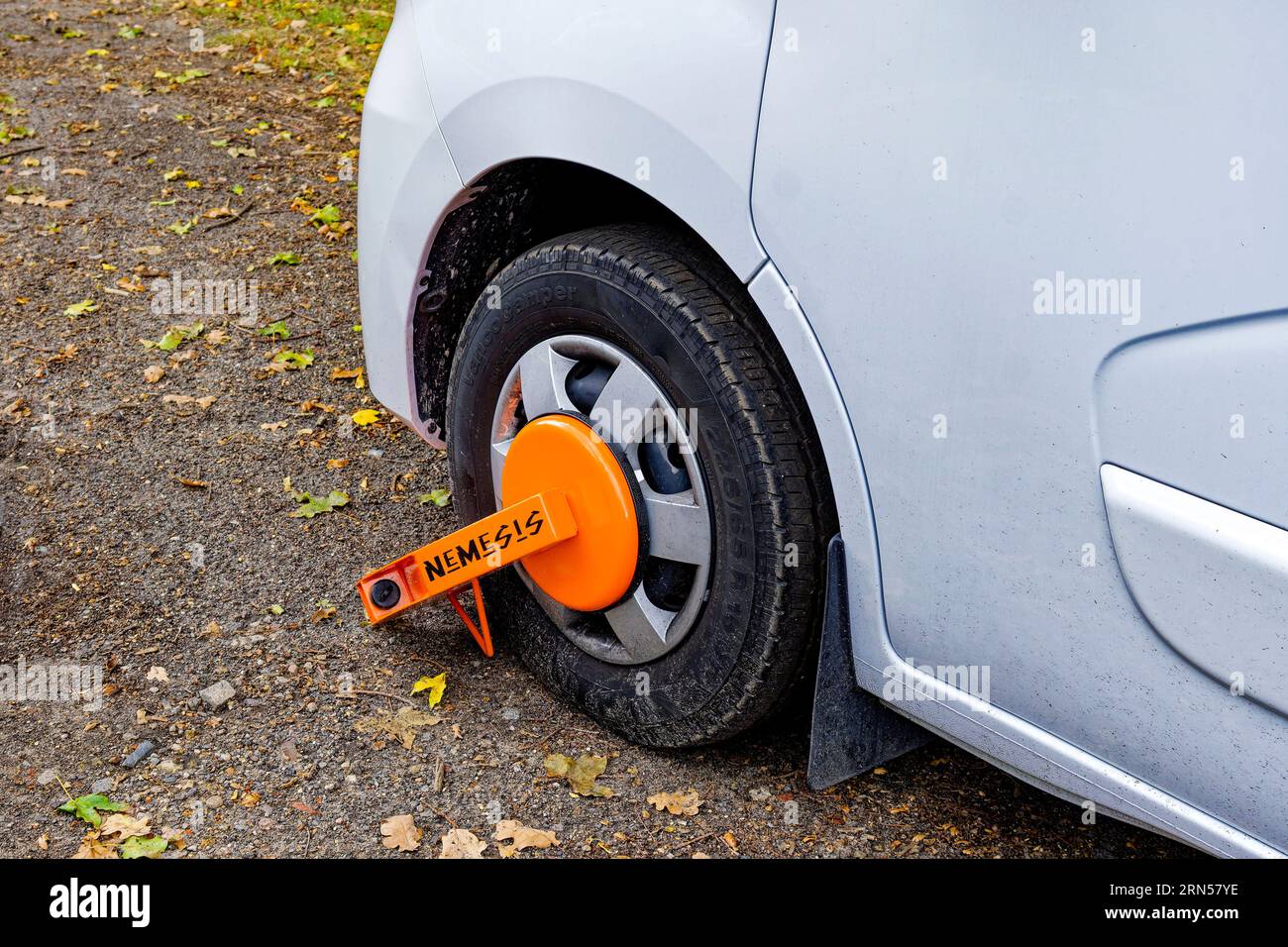 Berlin, Germany - October 6, 2021: Wheel of a car secured against theft ...