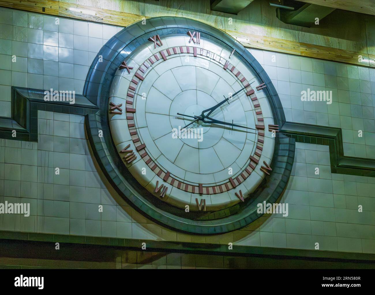 Large wall mounted clock above tunnel in Seattle Westlake station on ...