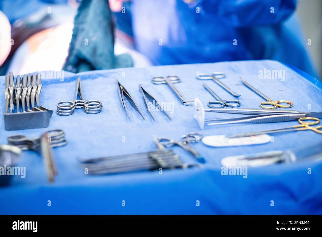 Operating table with surgical cutlery during an operation in a hospital ...