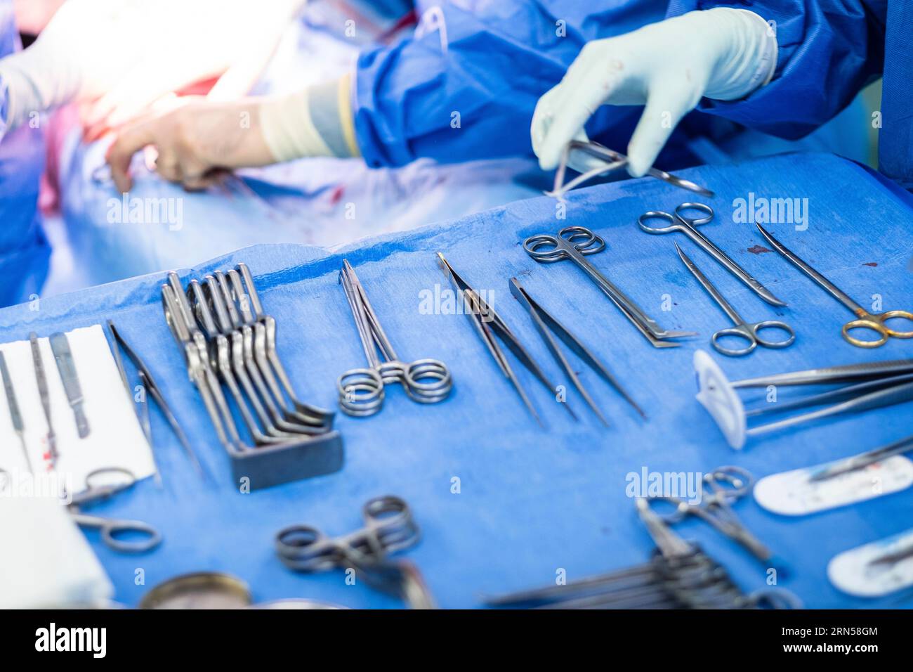 Operating table with surgical cutlery during an operation in a hospital ...