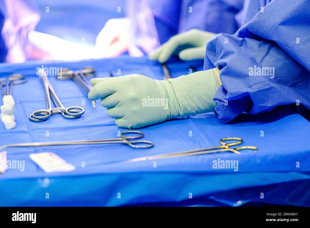Operating table with surgical cutlery during an operation in a hospital ...