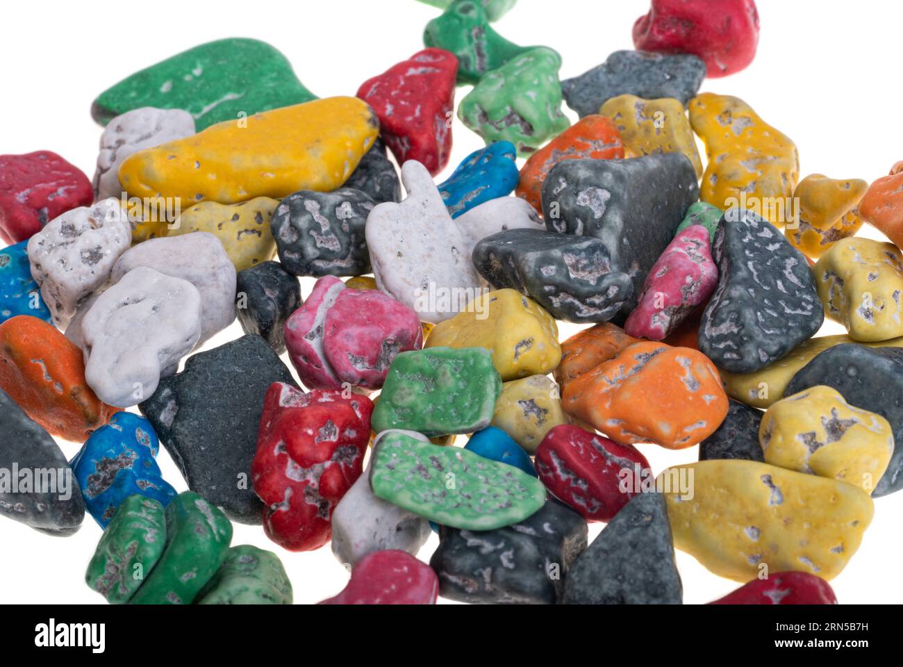 chocolate colored pebbles on a white background Stock Photo - Alamy