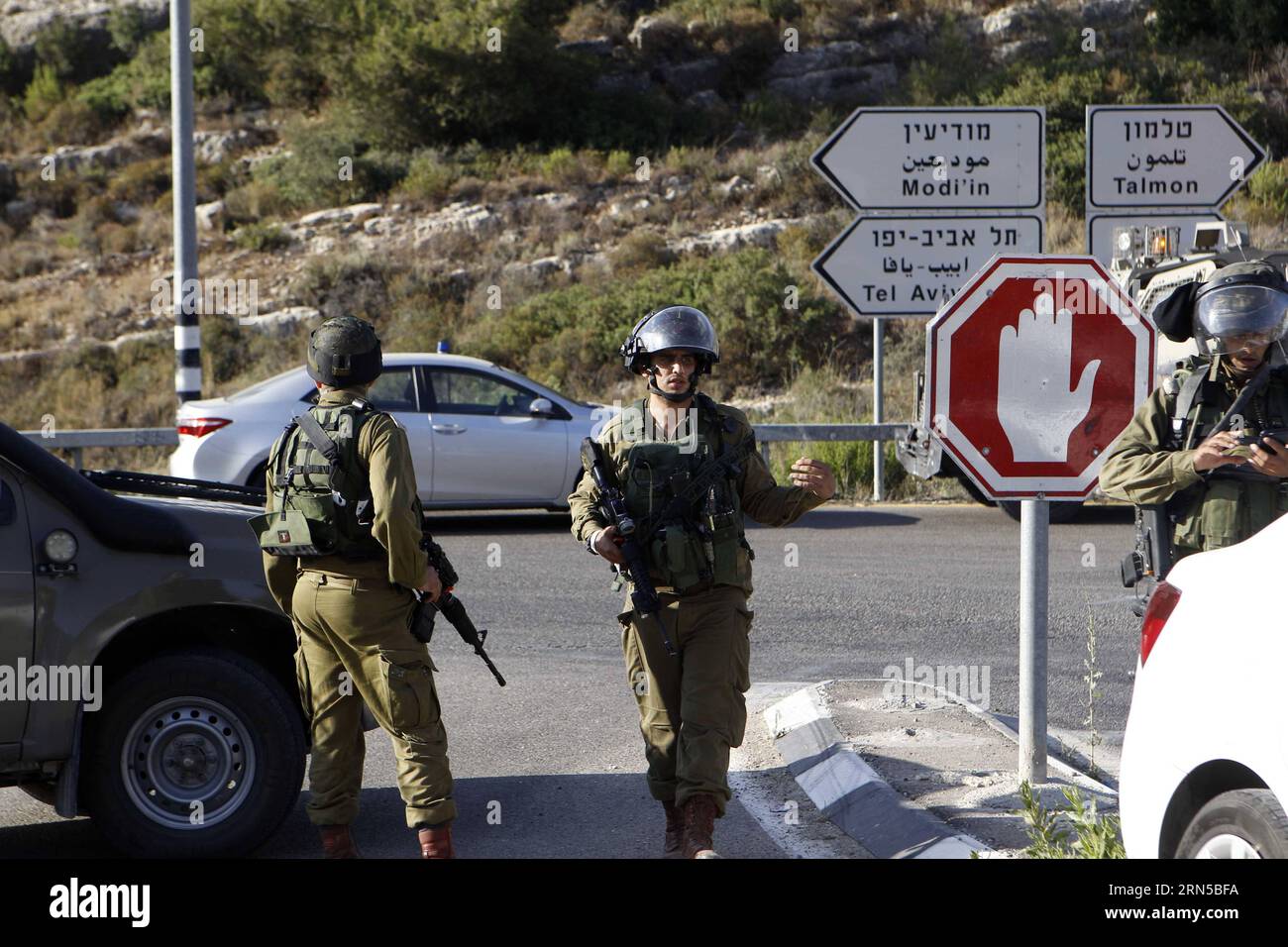 Israeli soldiers search an area where a Palestinian man attacked two ...