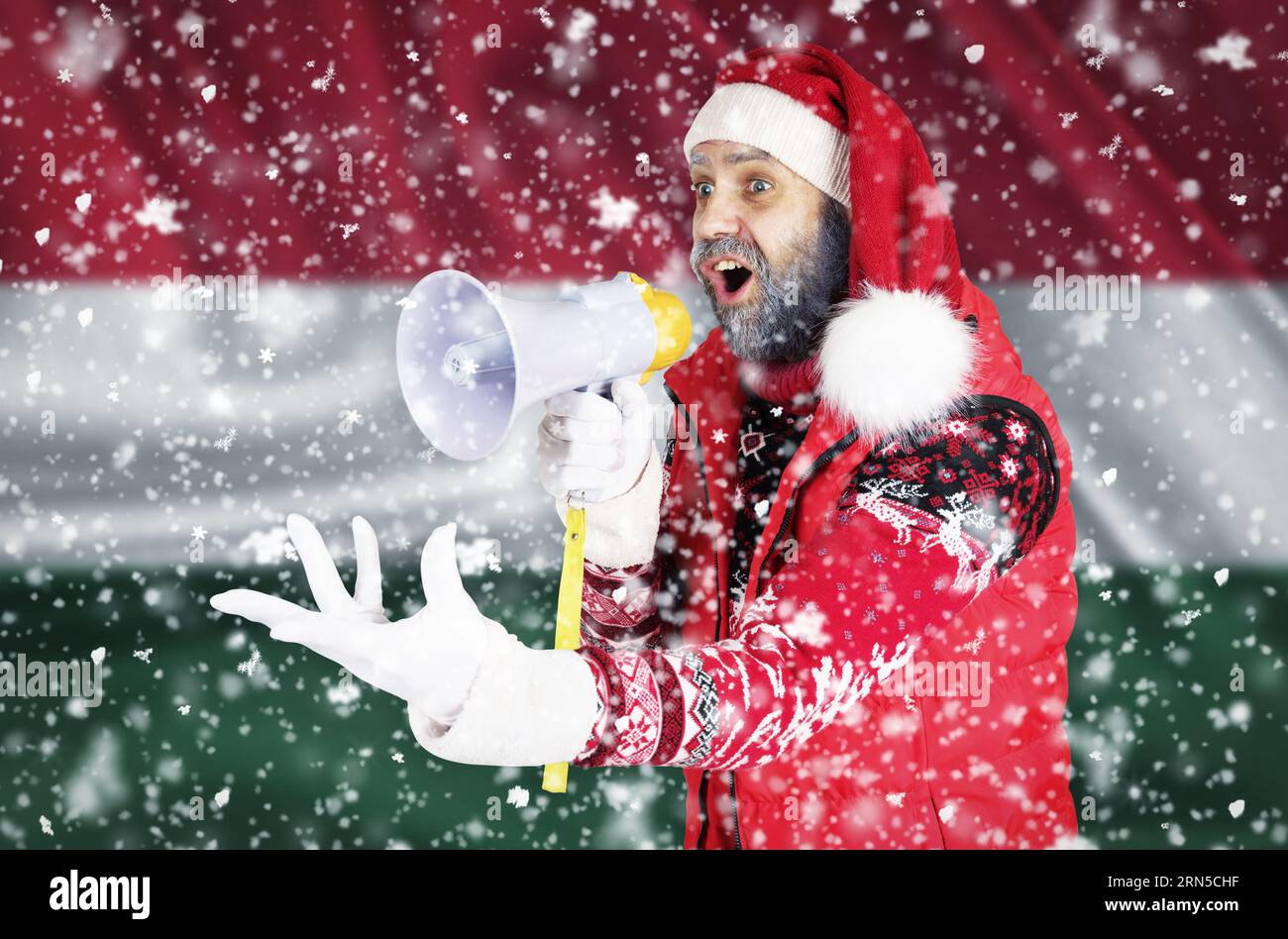 Santa Claus shouts into a bullhorn and shows an aggressive gesture with ...