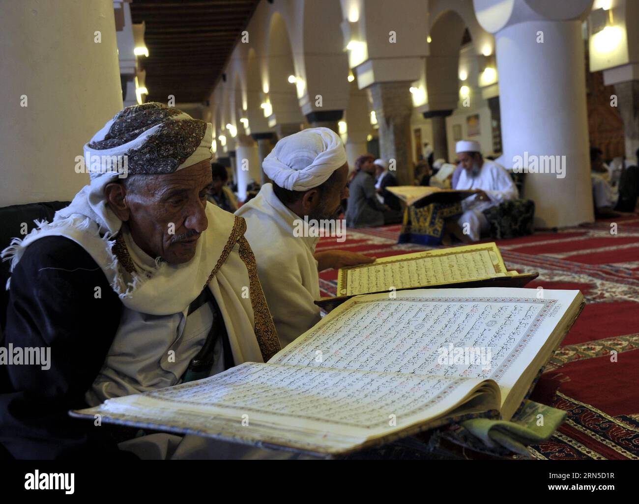 Yemeni people read the Quran in the holy month of Ramadan in a mosque ...