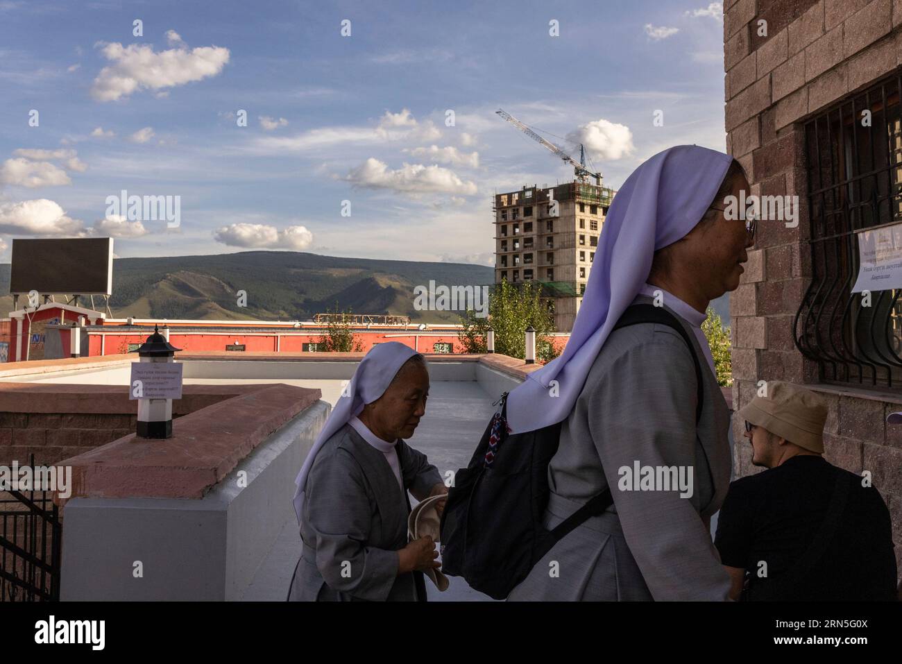 Catholic sisters enter Saints Peter and Paul Catholic Cathedral prior to a mass in Ulaanbaatar ...