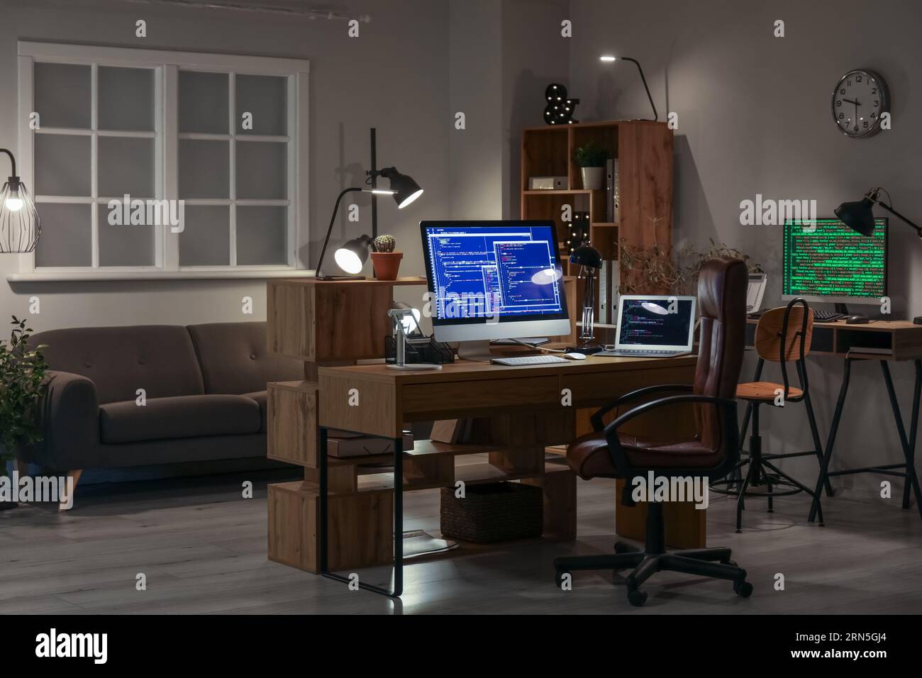 Interior of dark office with programmer's workplaces Stock Photo - Alamy