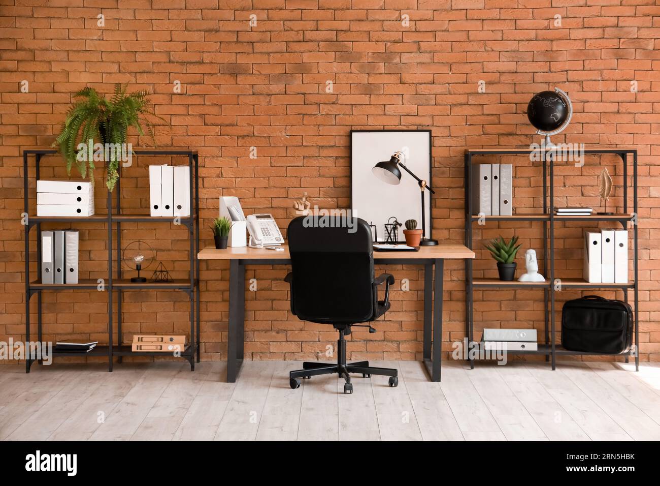 Interior of office with workplace and shelving units Stock Photo - Alamy