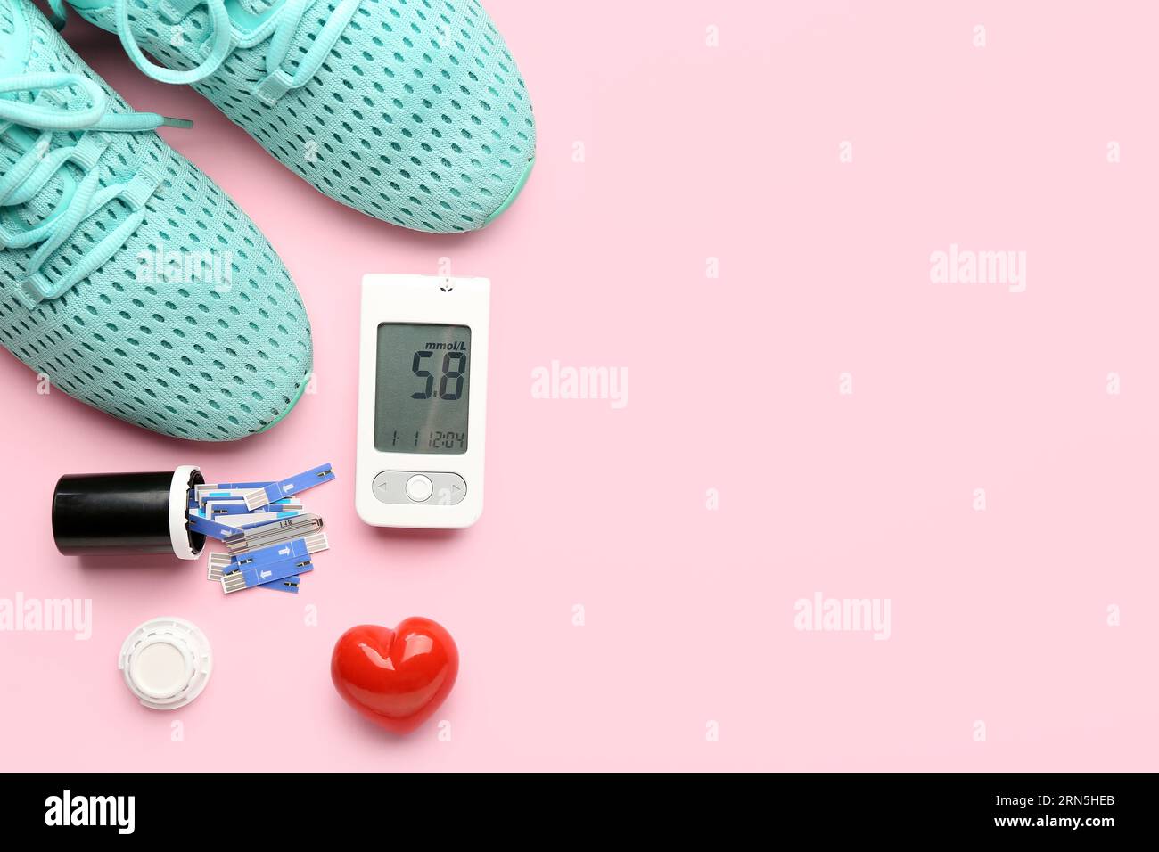 Glucometer with result of measurement sugar level, sneakers and ...
