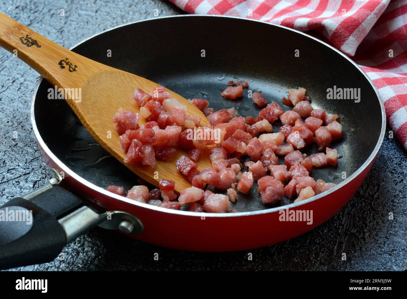 Fried bacon cubes in pan, bacon Stock Photo - Alamy