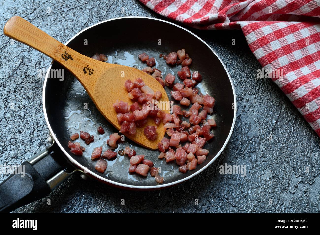Fried bacon cubes in pan, bacon Stock Photo - Alamy