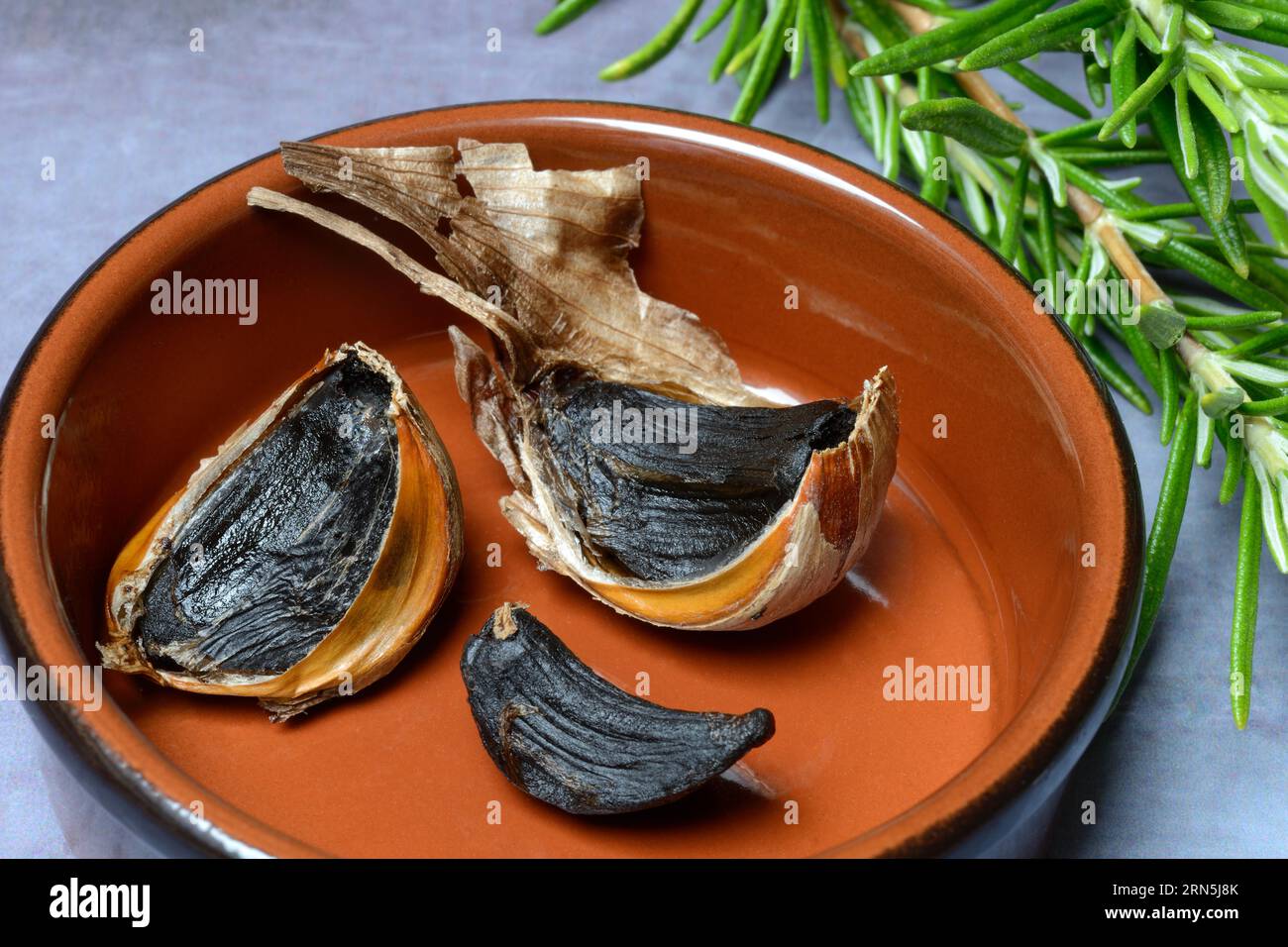 Black fermented garlic, garlic cloves Stock Photo - Alamy