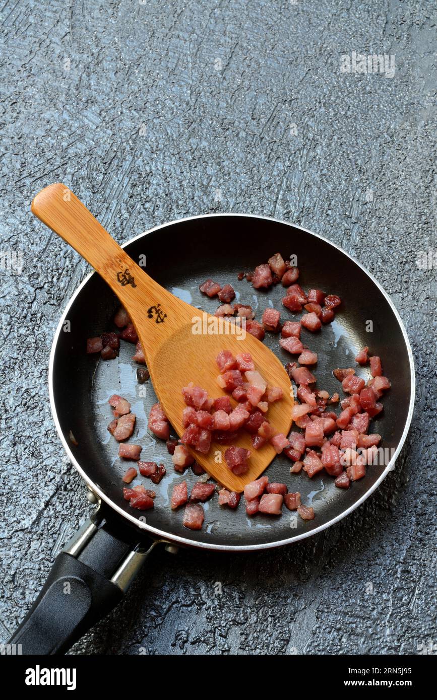 Fried bacon cubes in pan, bacon Stock Photo - Alamy
