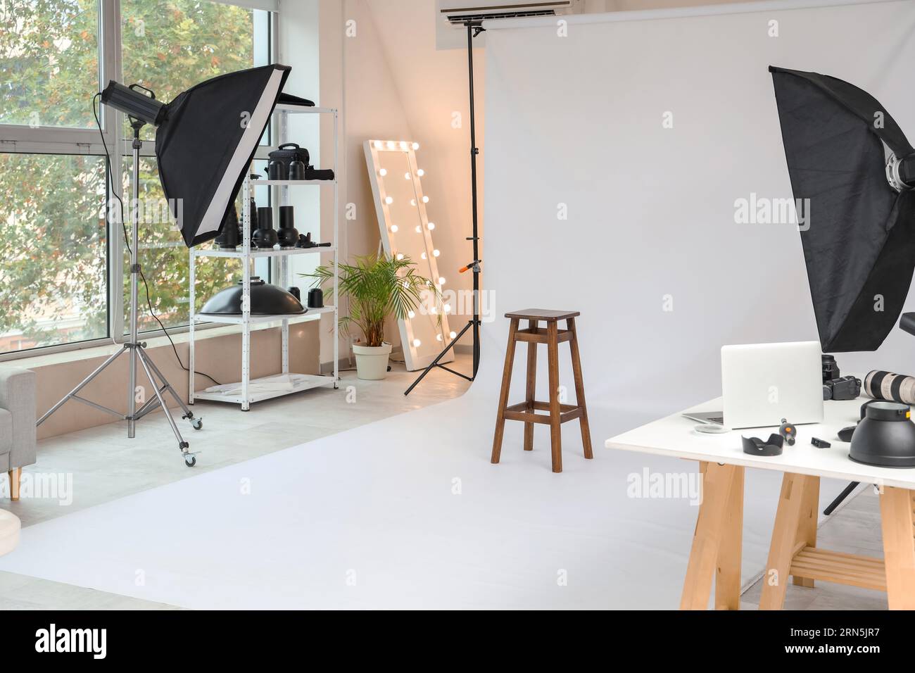 Interior of photo studio with equipment and stool Stock Photo - Alamy