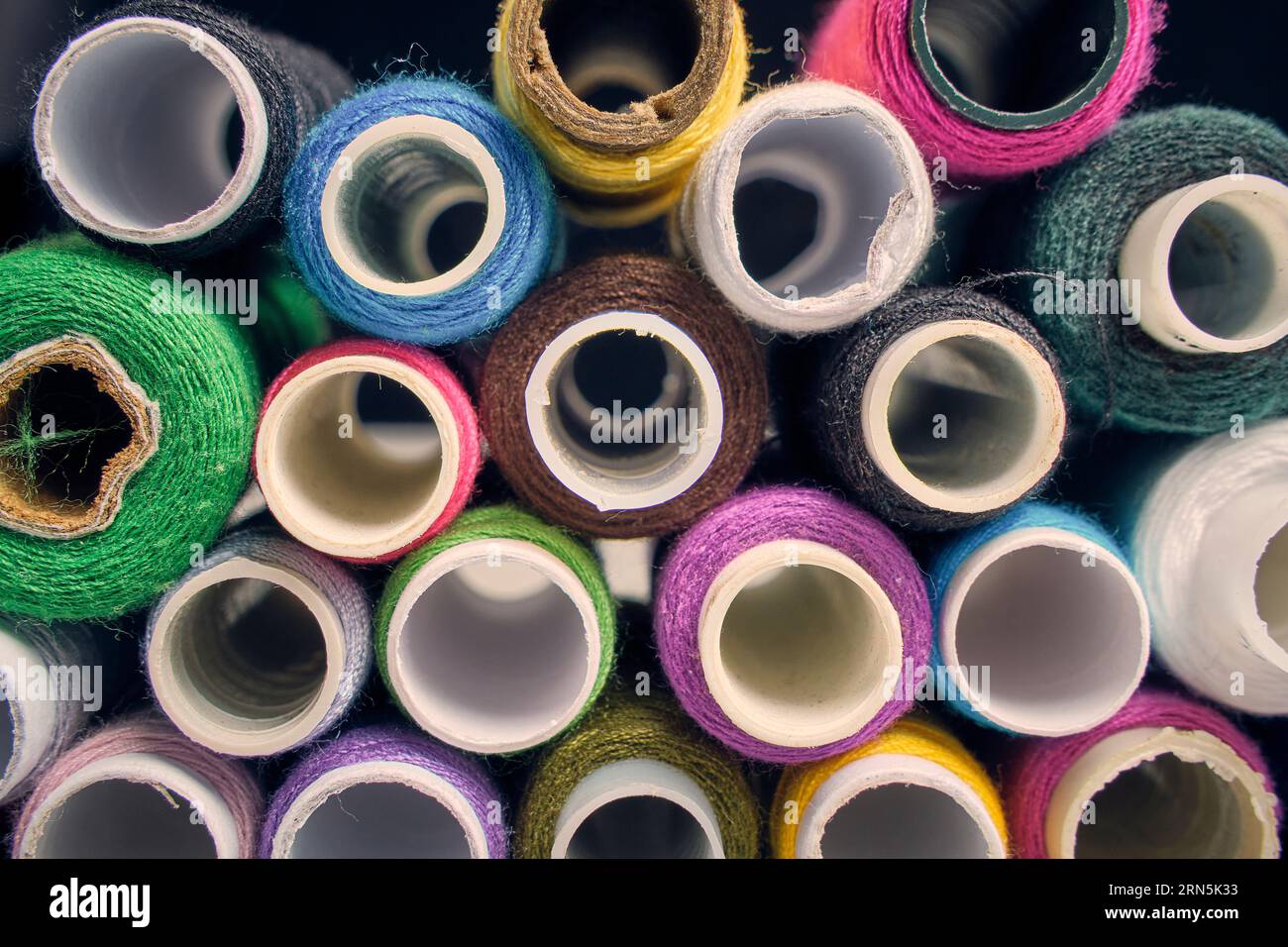 Set multicolored threads for cutting and sewing Stock Photo - Alamy