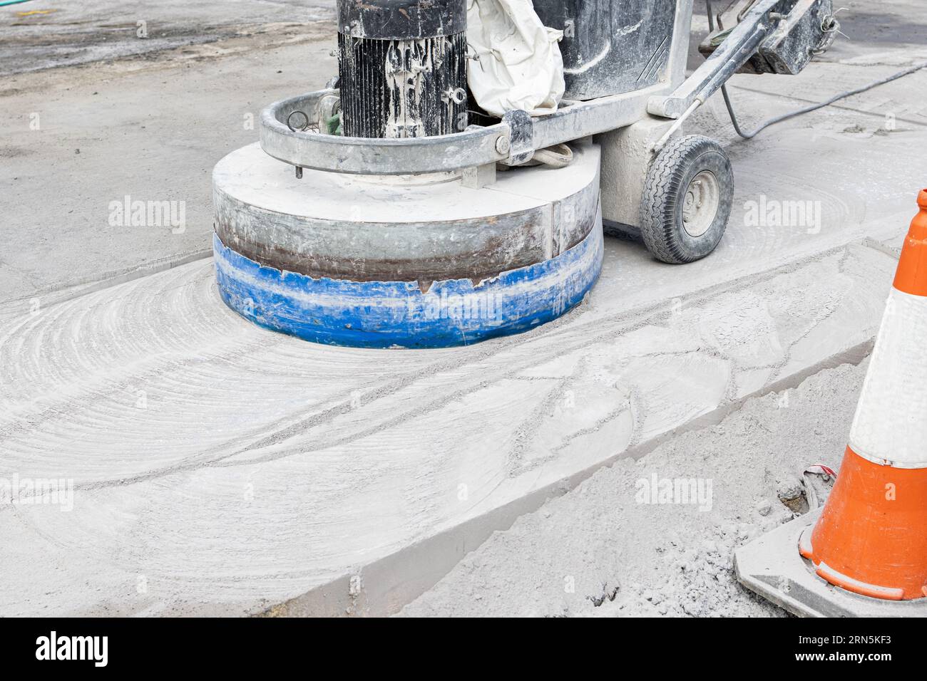 Working Grinding machine polishing a Concrete surface of a city road ...