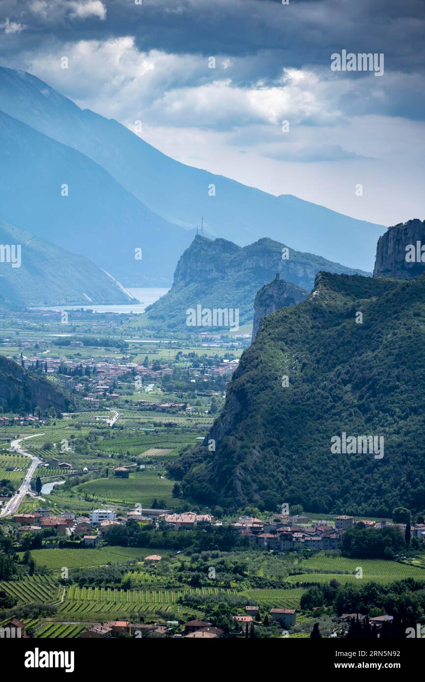 View into the Sarca Valley towards Lake Garda with rocks of Castello di ...