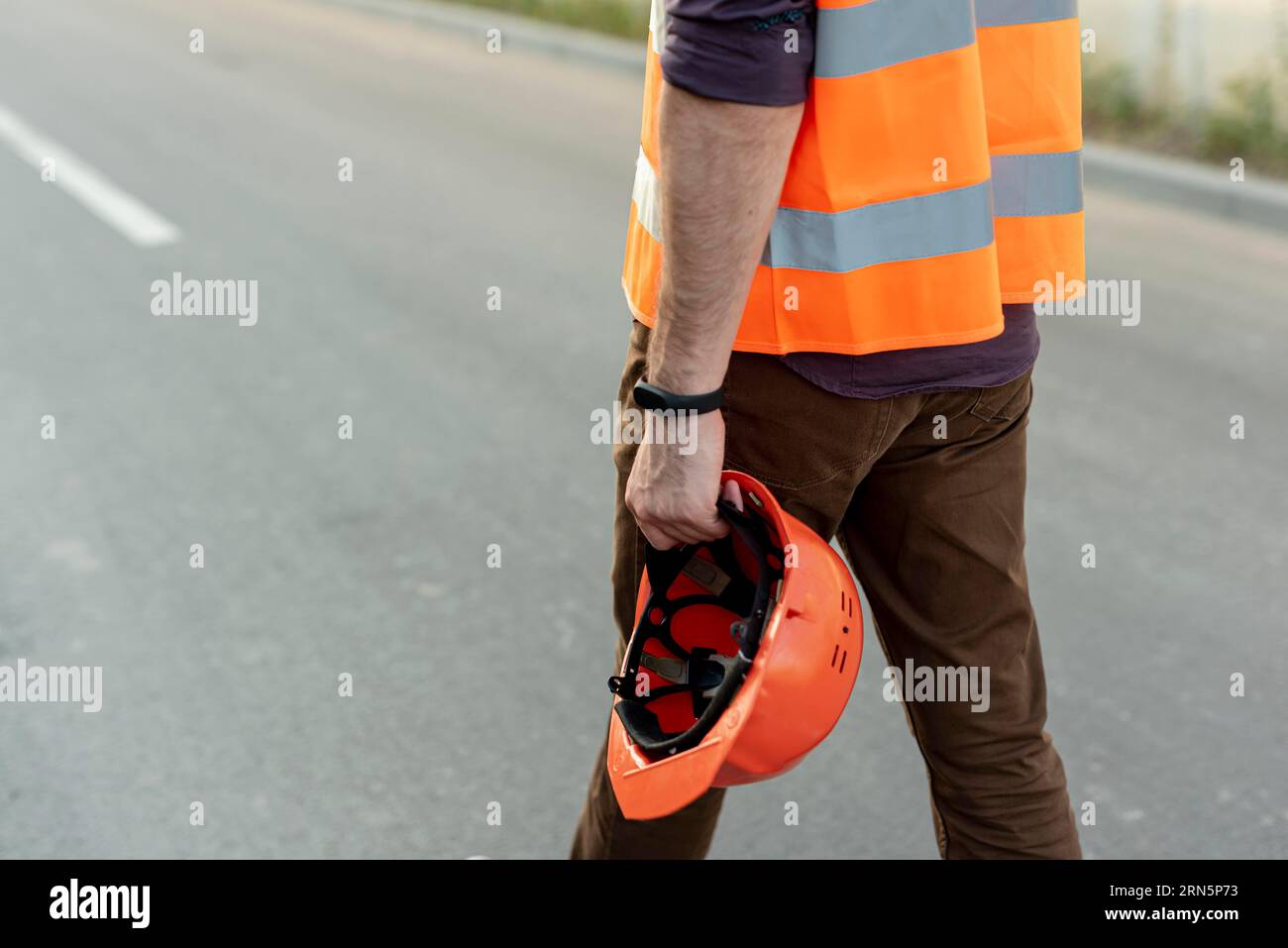 Back view man with protection helmet Stock Photo - Alamy