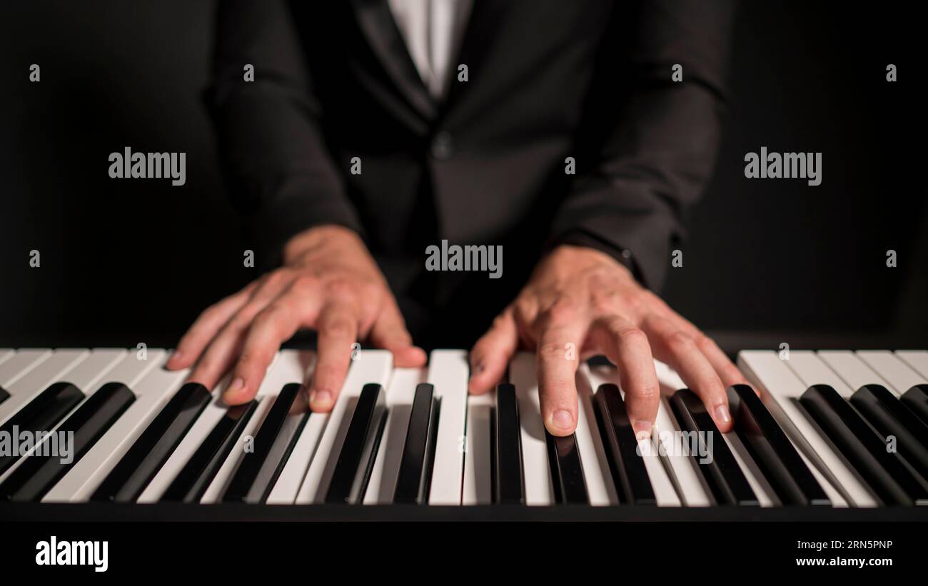 Close up front view professional keyboard player Stock Photo - Alamy