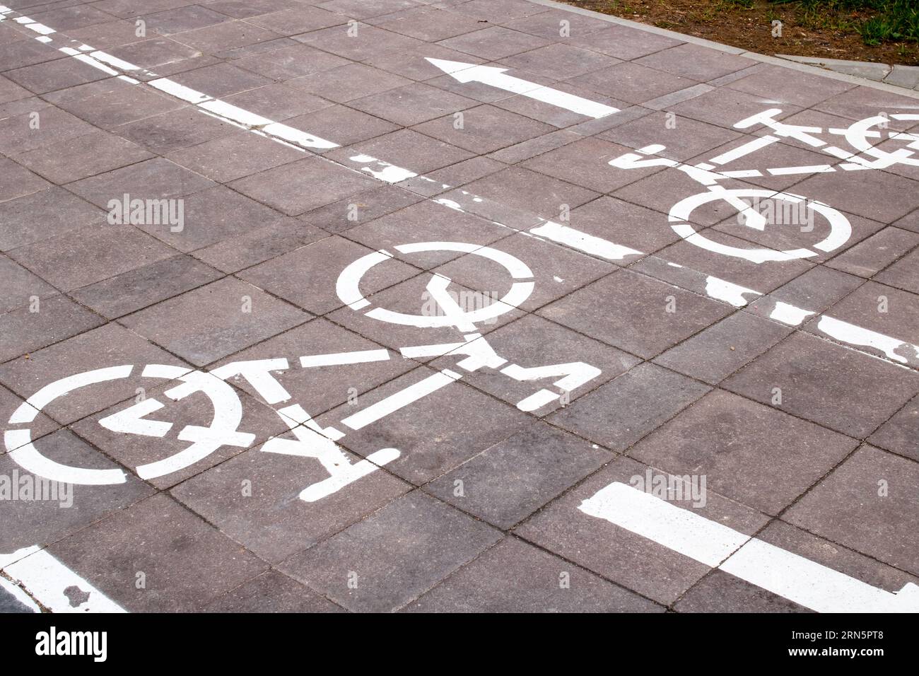 Road sign bicycle path on the sidewalk close up Stock Photo - Alamy