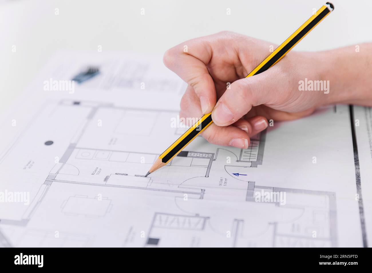 Close up hand correcting draft Stock Photo - Alamy