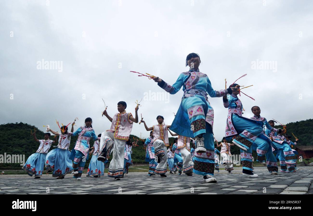 WEINING, Middle School student perform the traditional Yi bell dance at ...